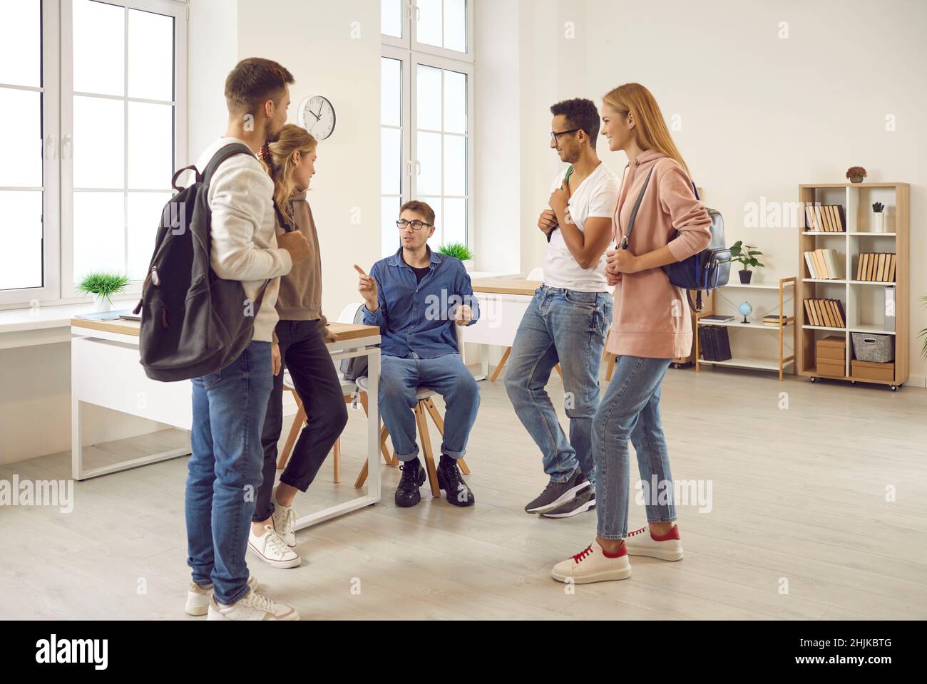 Happy diverse students at break in college Stock Photo - Alamy