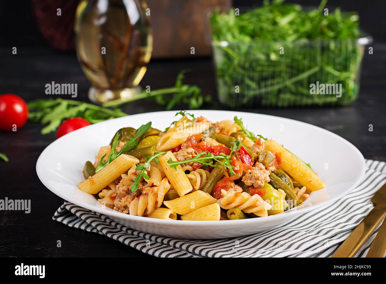 Italian pasta penne and fusilli with minced meat and vegetables. Lunch ...
