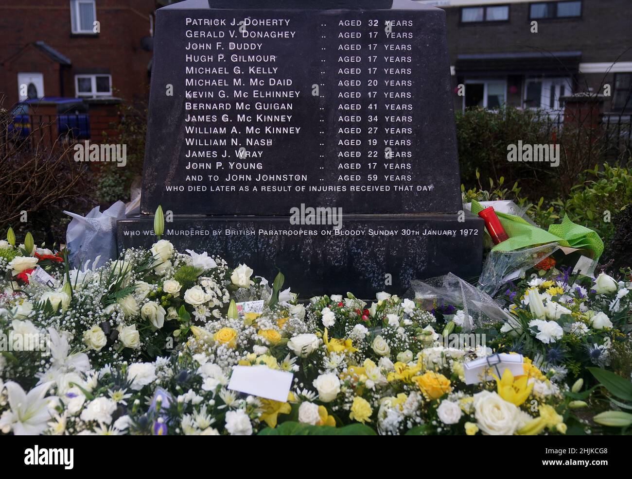 Flowers left at the Bloody Sunday memorial in Derry on the 50th ...