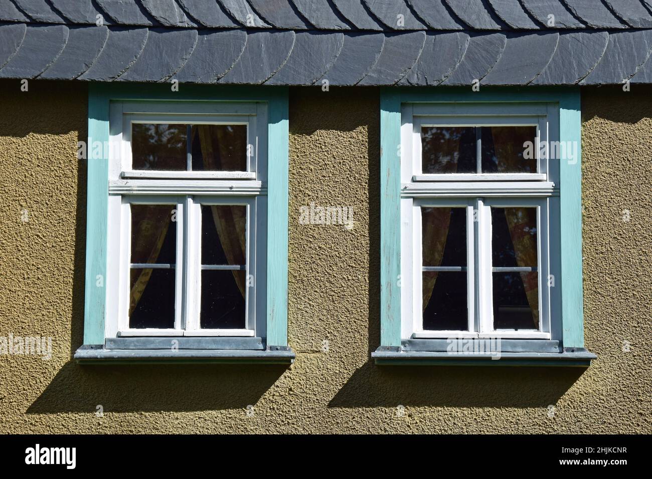 House facade with traditional lattice windows Stock Photo - Alamy