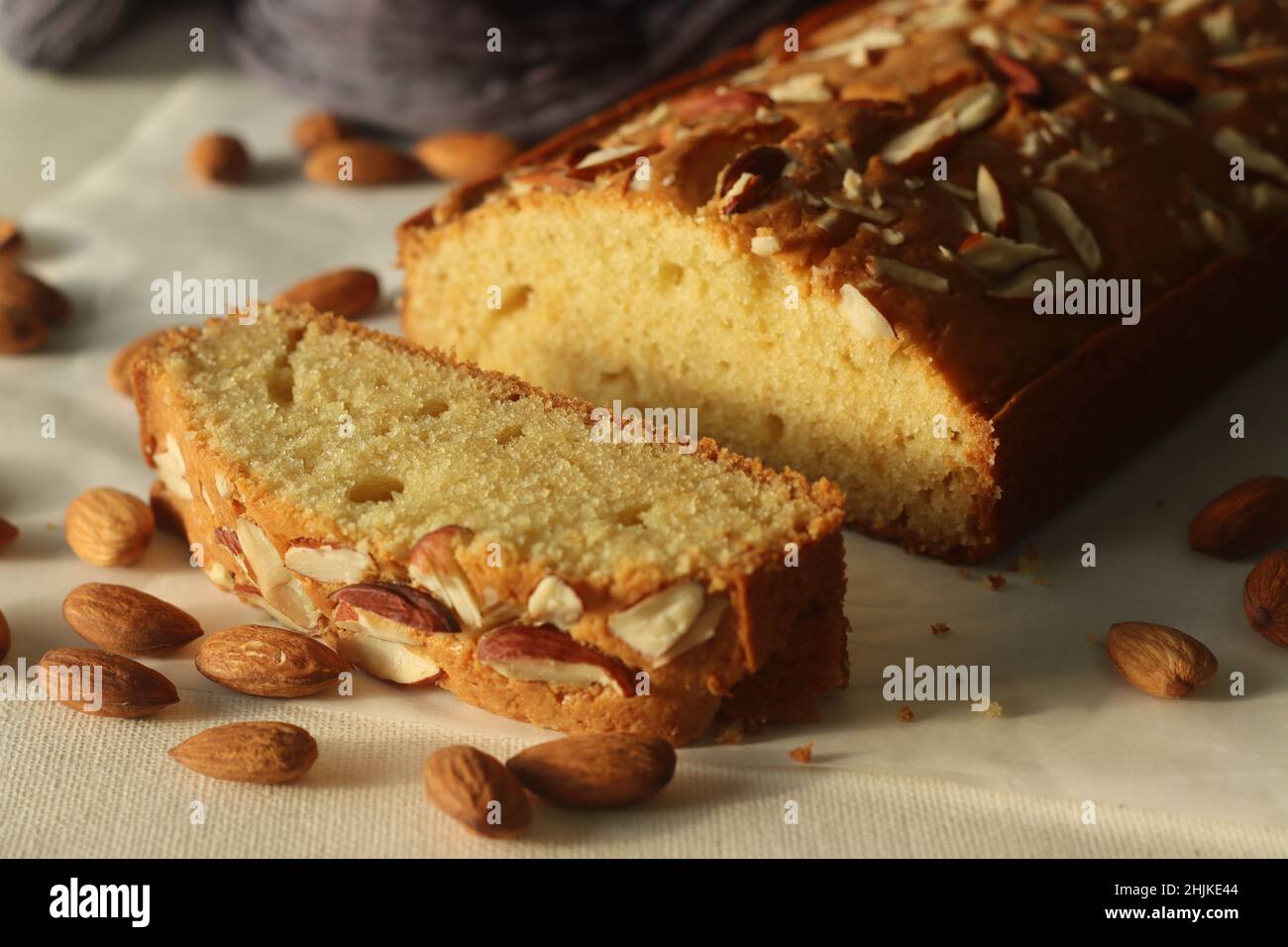 Ghee cake slice. Vanilla flavoured ghee cake with almonds on top. The ...