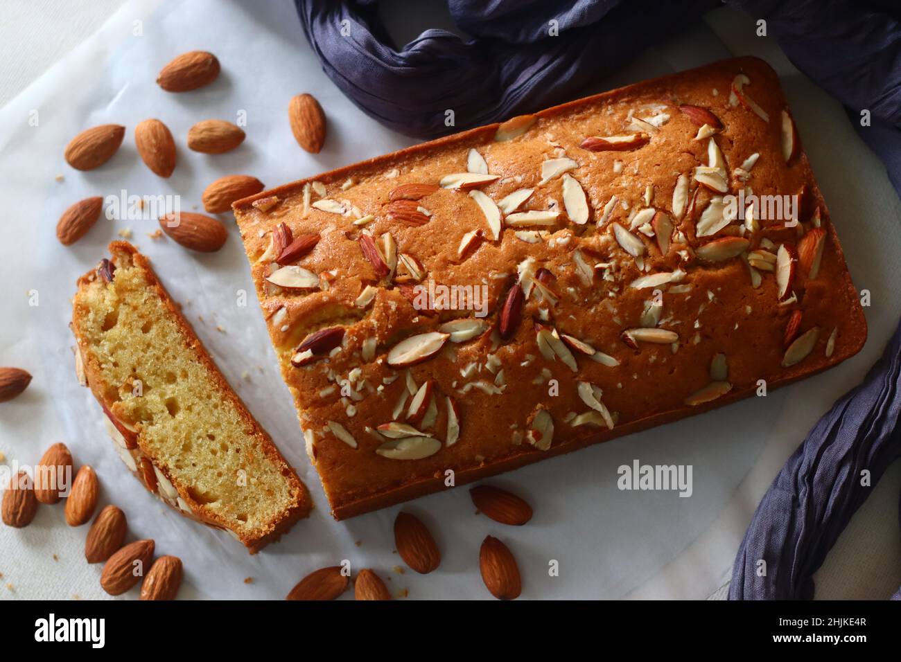 Ghee cake slice. Vanilla flavoured ghee cake with almonds on top. The ...