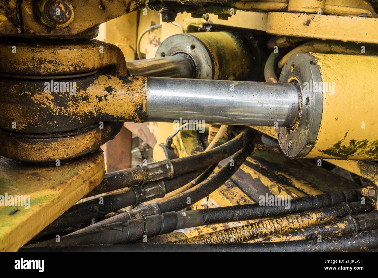 hydraulic pistons of an old excavator machine Stock Photo - Alamy