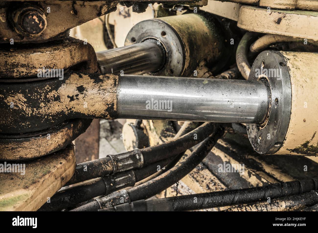 hydraulic pistons of an old excavator machine Stock Photo - Alamy