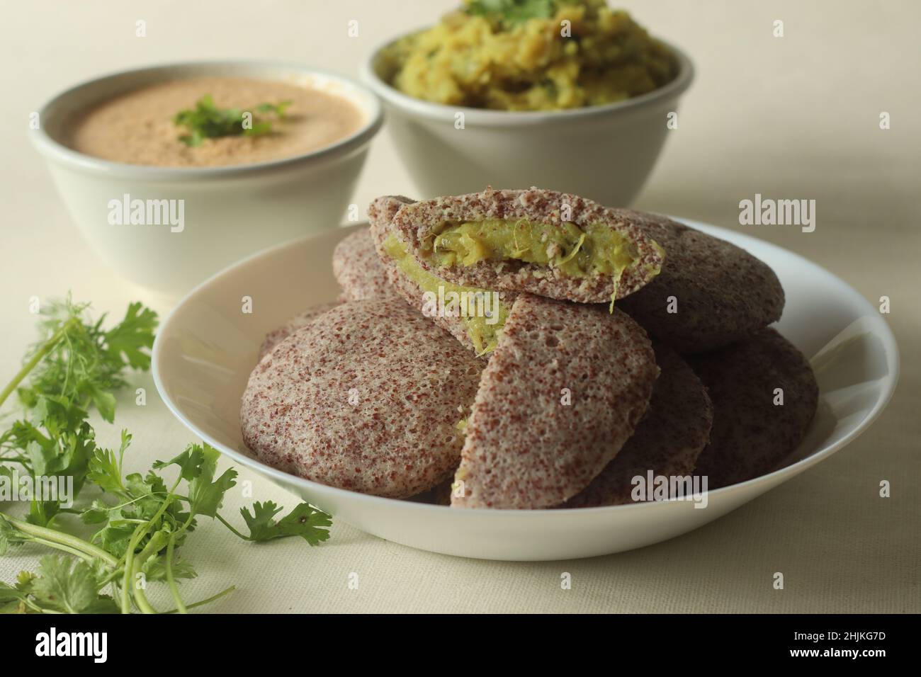 Potato stuffed ragi idli. Steamed finger millet cakes stuffed with ...