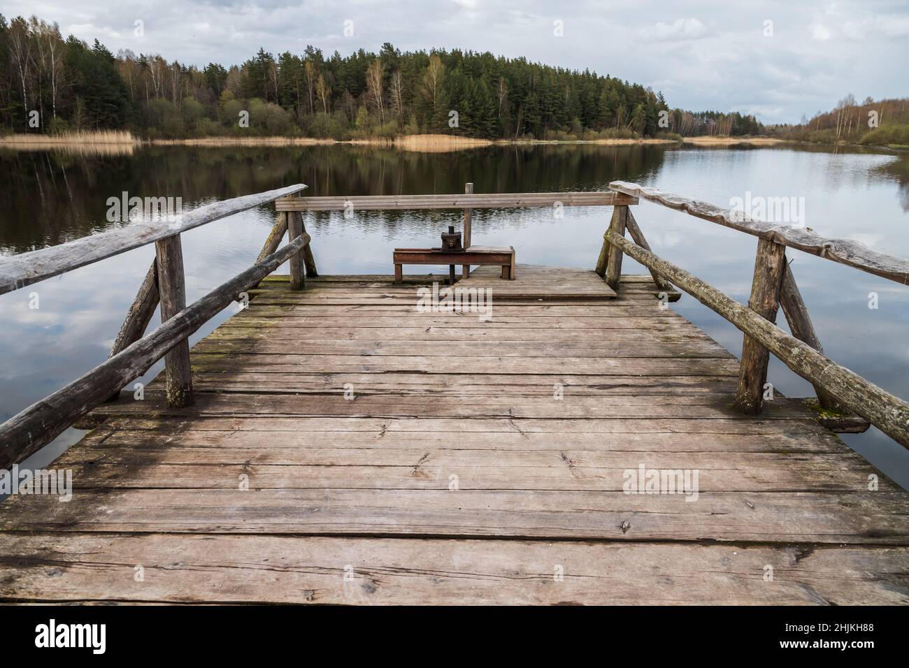 Rural landscape with an empty wooden pier perspective. Pskov Oblast ...