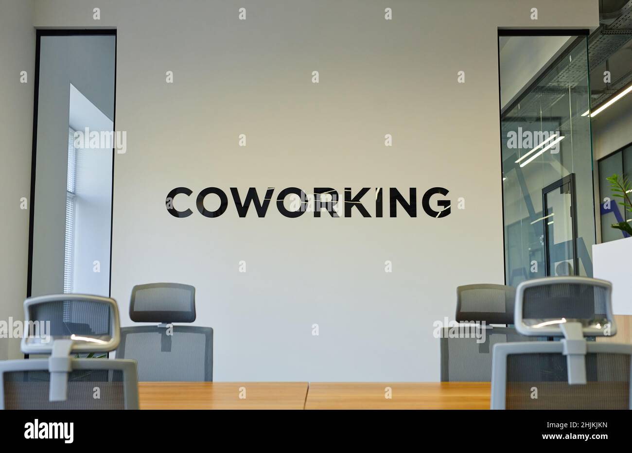 Background image of coworking space interior with meeting table and ...