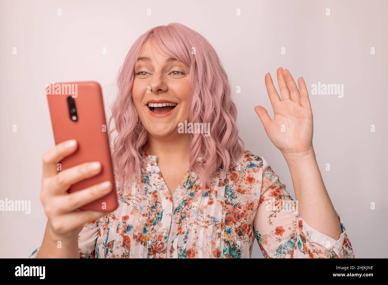 Woman talking with a boyfriend waving hand while chatting on video ...