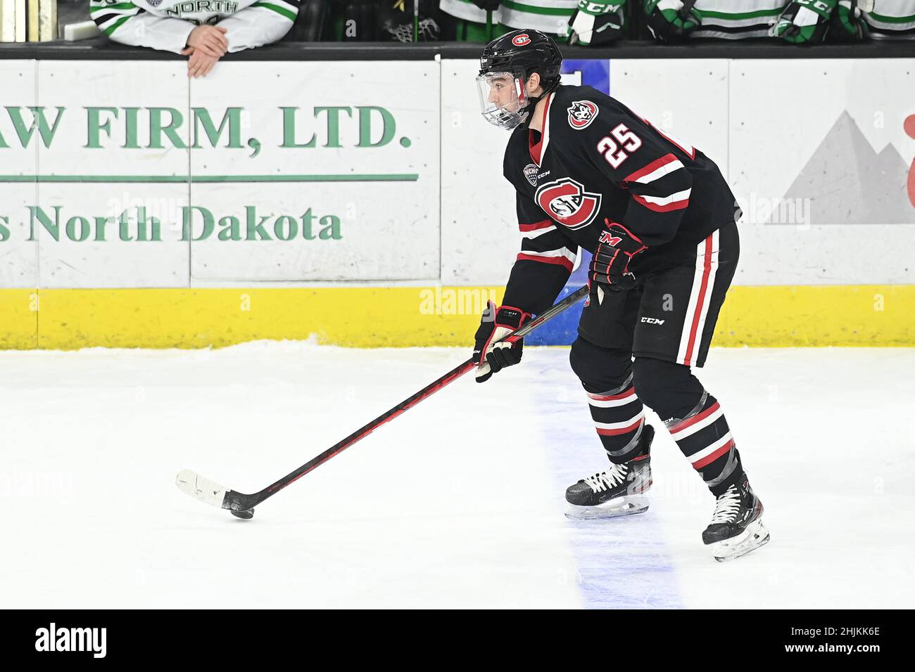 St. Cloud State Huskies defenseman Nick Perbix (25) skates the puck up ...