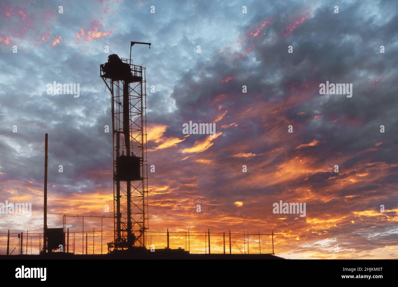 Oil and gas drill rig silhouette at sunset Stock Photo - Alamy