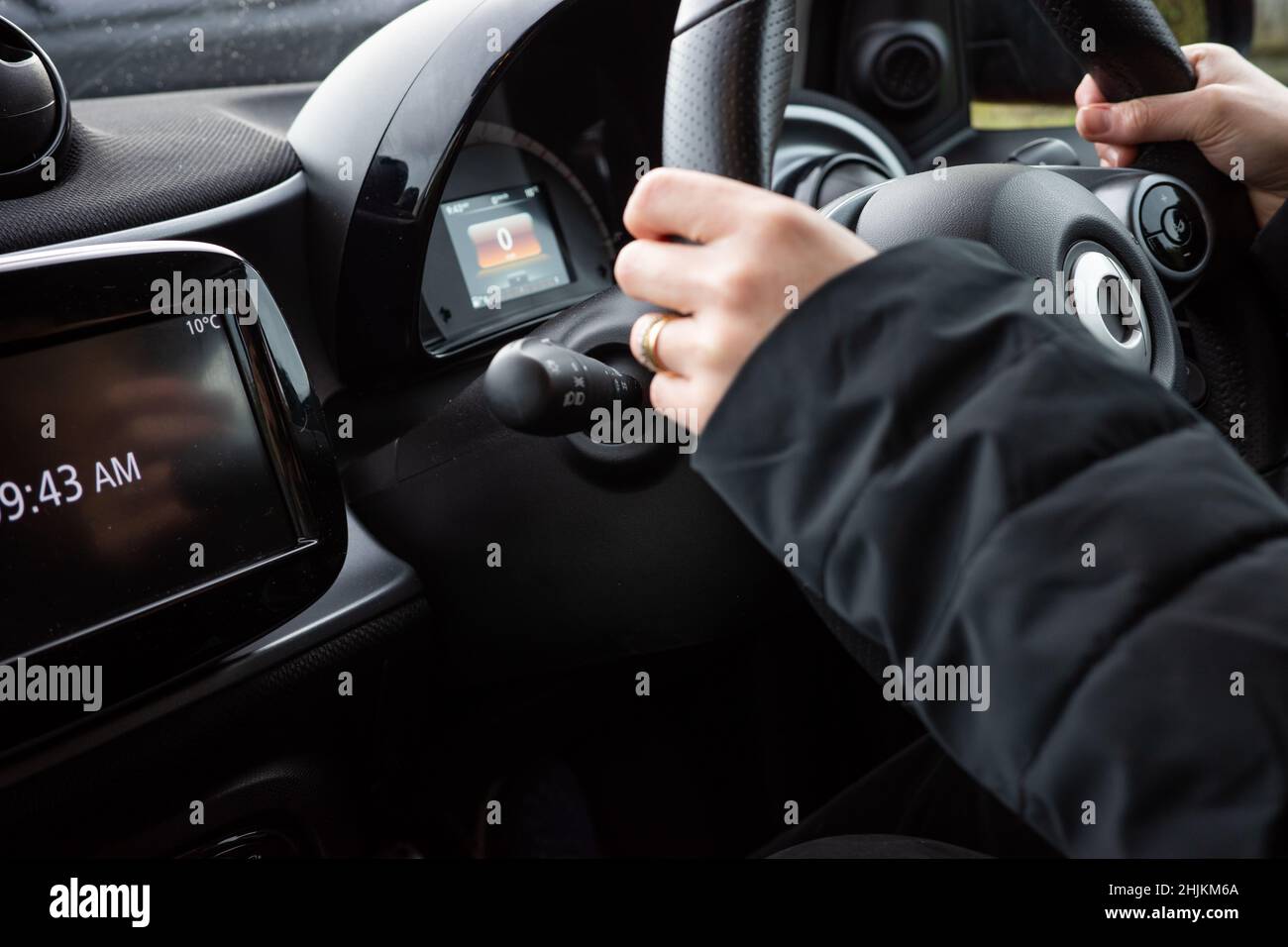 Unidentifiable human driving a car Stock Photo - Alamy