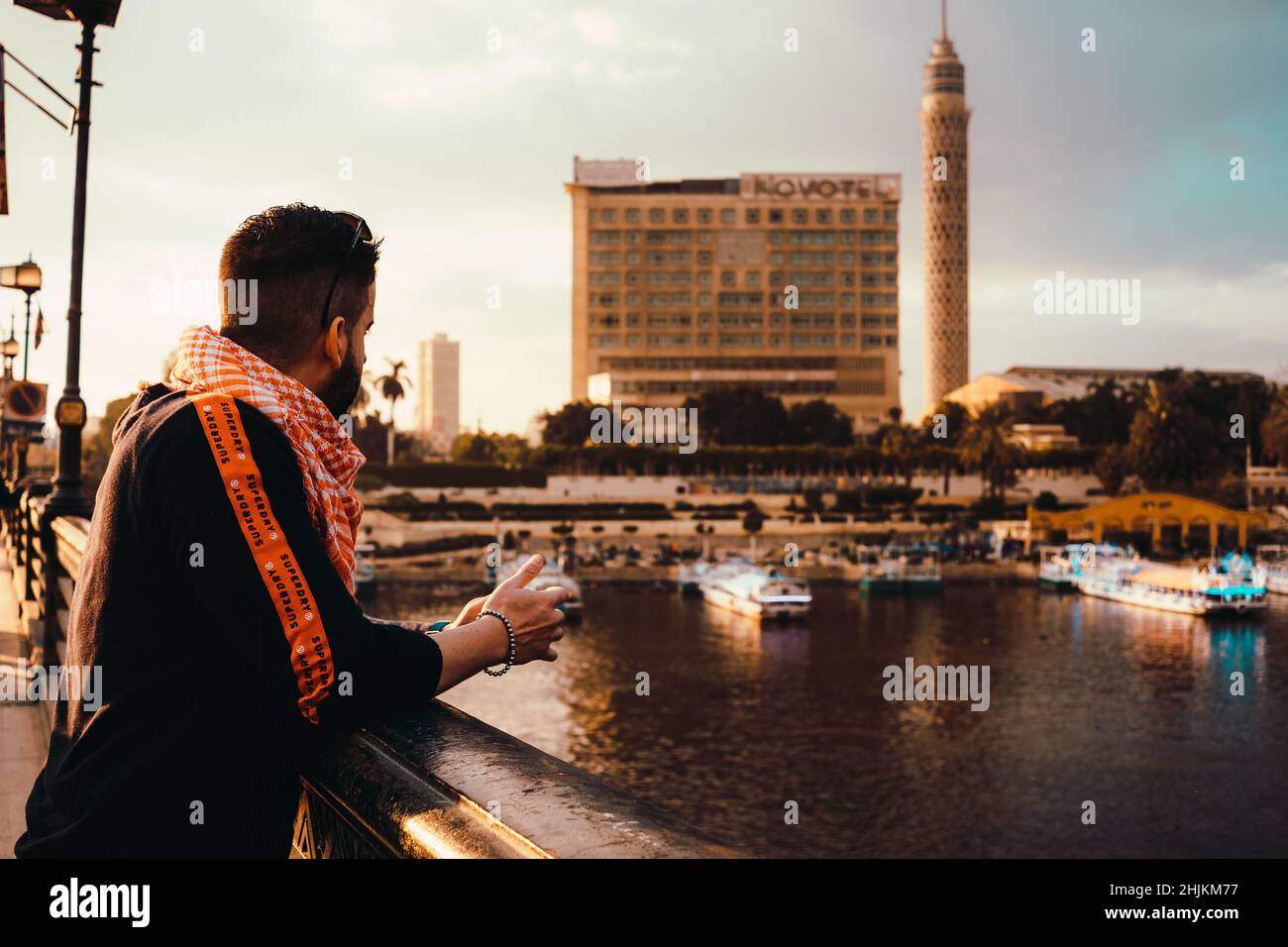 Cairo Egypt December 2021 Man leaning on the fence of a bridge leading ...