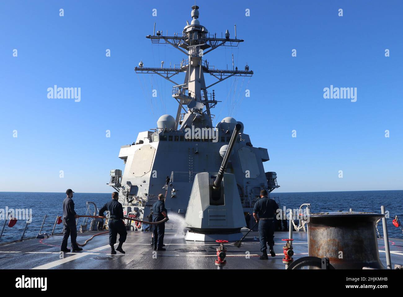 PACIFIC OCEAN (Jan. 2, 2022) Sailors conduct a wash down aboard the ...