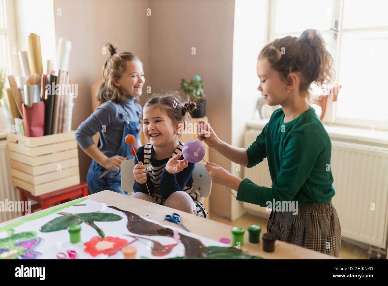 Group of little kids working on project during creative art and craft ...