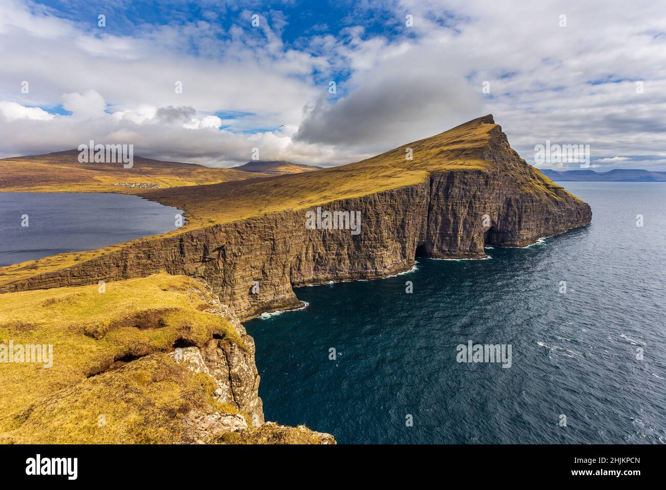 View of the Slave Cliff and Leitisvatn Lake on Vagar Island. Beautiful ...