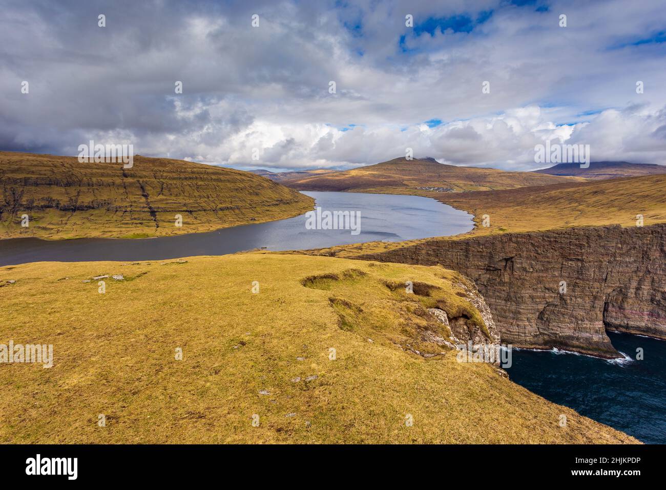 View of the Slave Cliff and Leitisvatn Lake on Vagar Island. Beautiful ...