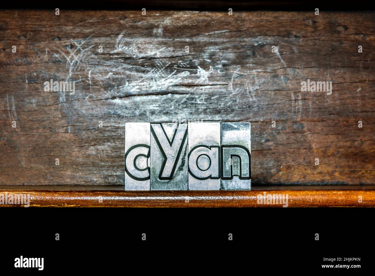 Cyan made with metalic types on a shelf Stock Photo - Alamy