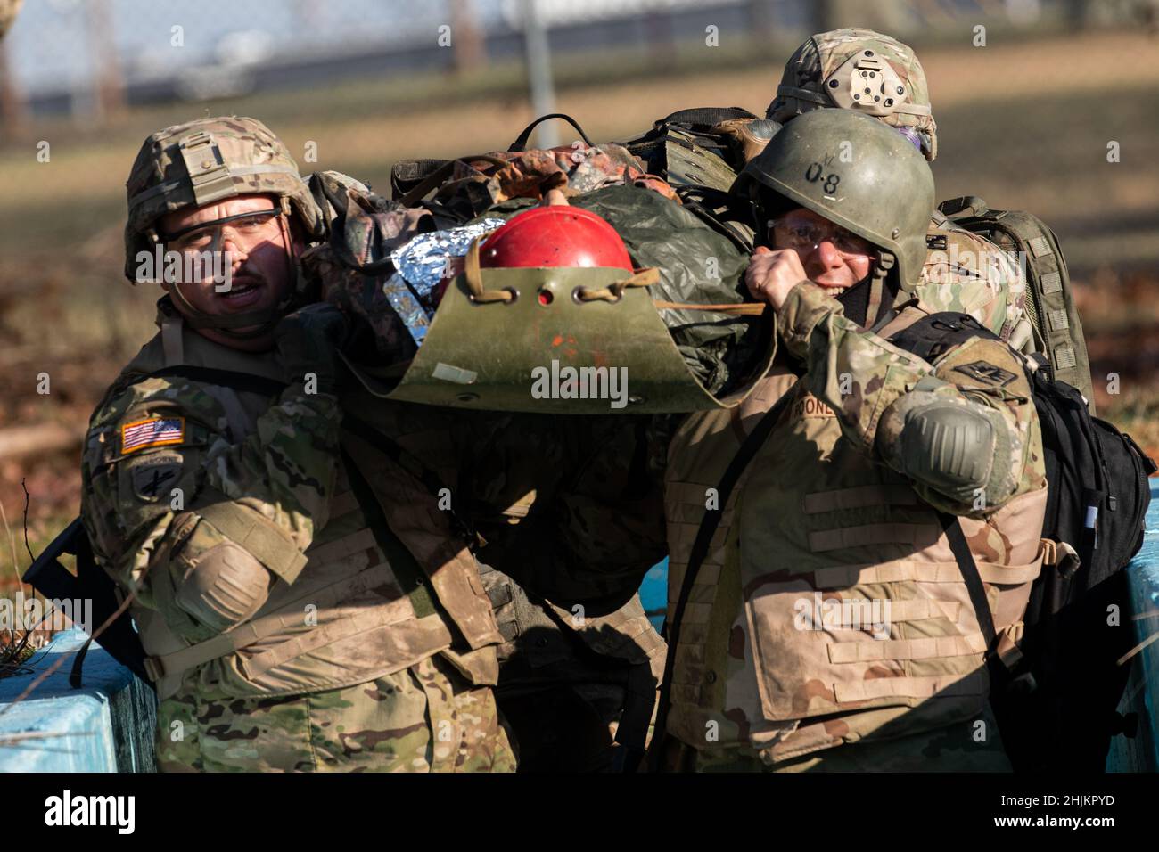 U.S. Army combat medics carry a simulated casualty during trainng at ...