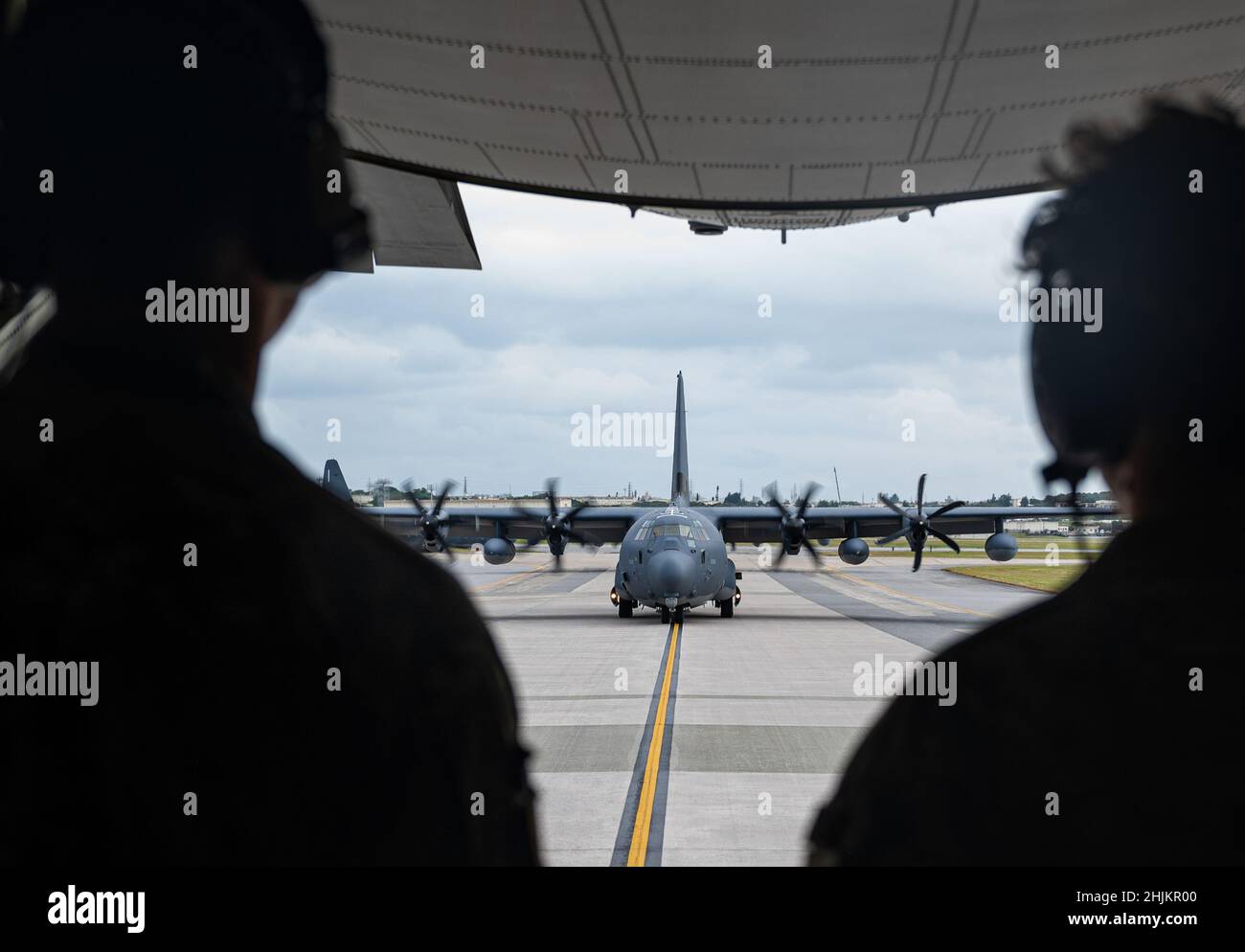 1st Special Operations Squadron loadmasters, observe a 1st SOS MC-130J ...