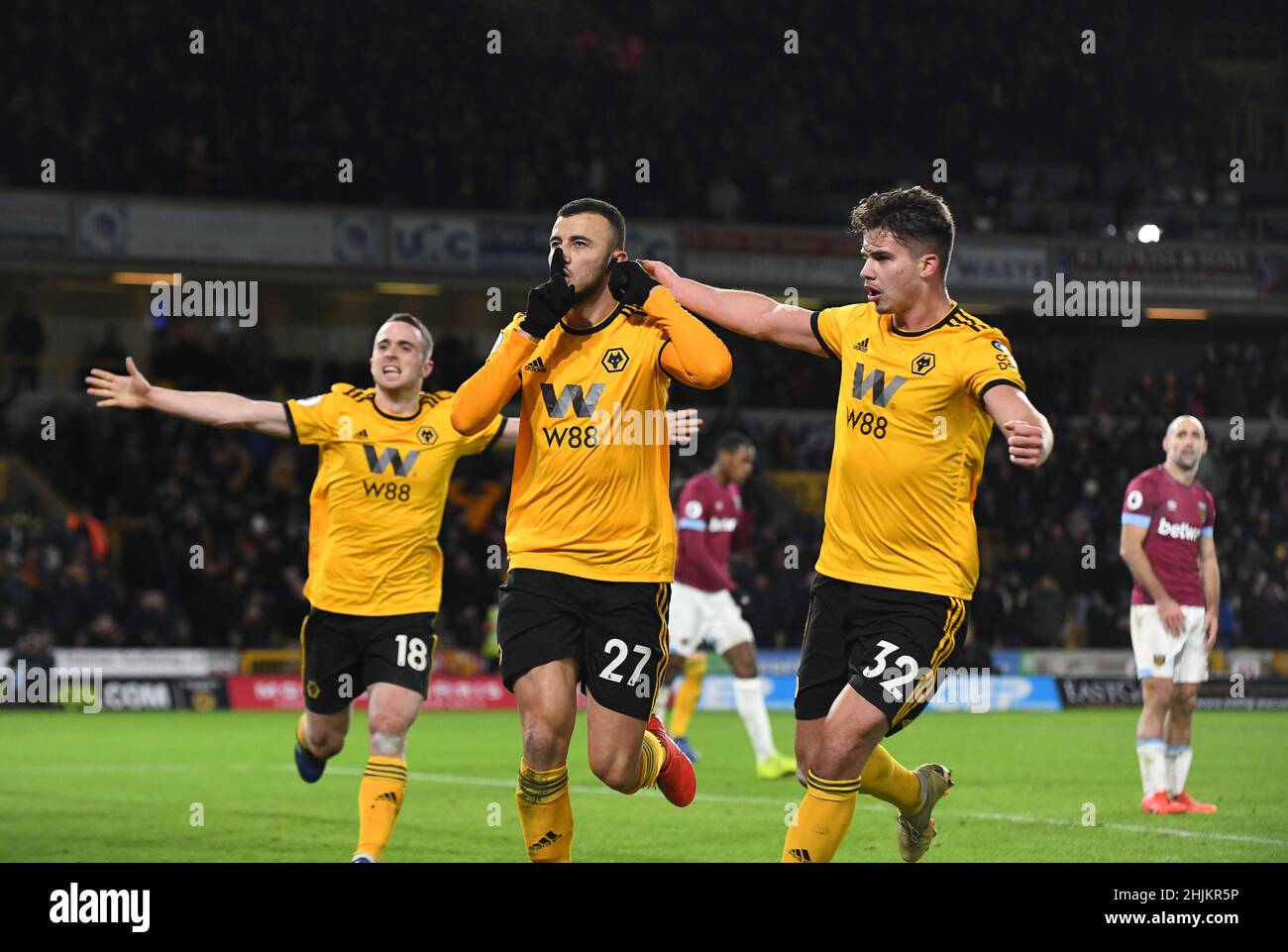 Wolves footballer Romain Saiss celebrates his goal with Leander ...