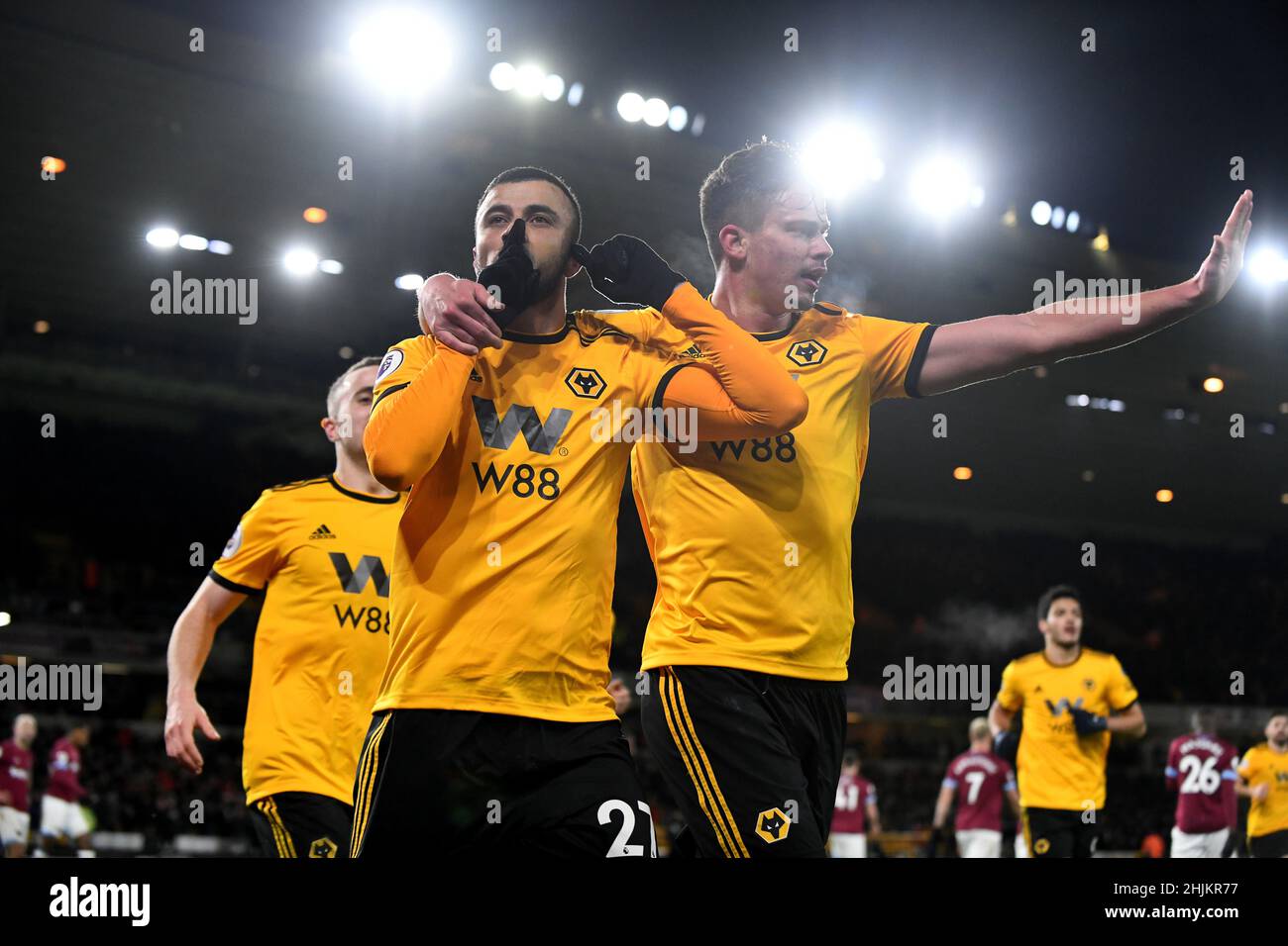 Wolves footballer Romain Saiss celebrates his goal with Leander ...