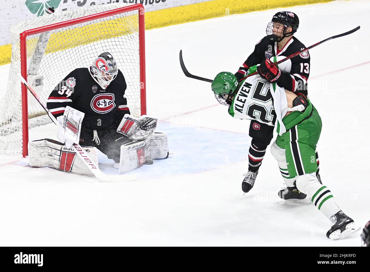 St. Cloud State Huskies goaltender David Hrenak (34) stops a shot by North Dakota Fighting Hawks ...