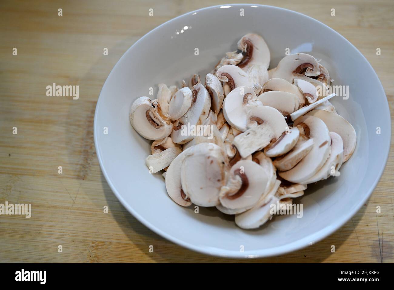organic sliced button mushrooms sliced and ready for cooking Stock ...