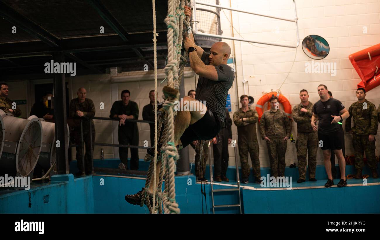 A Survival, Evasion, Resistance and Escape instructor demonstrates rope ...