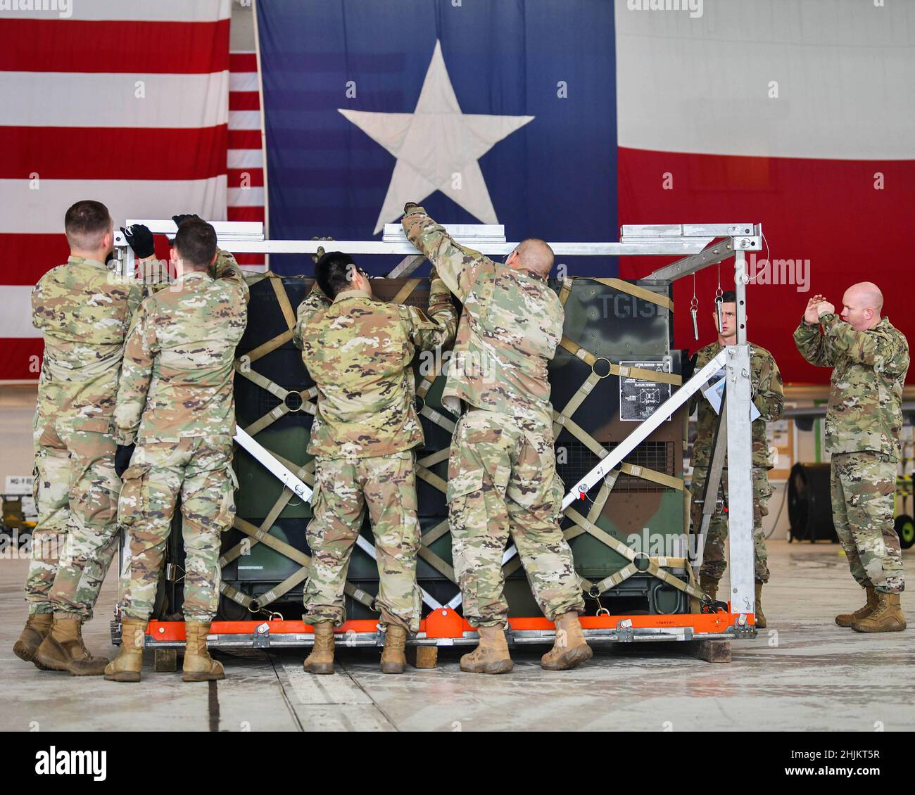 Members of the 147th Attack Wing test a vertical pallet stacking system ...