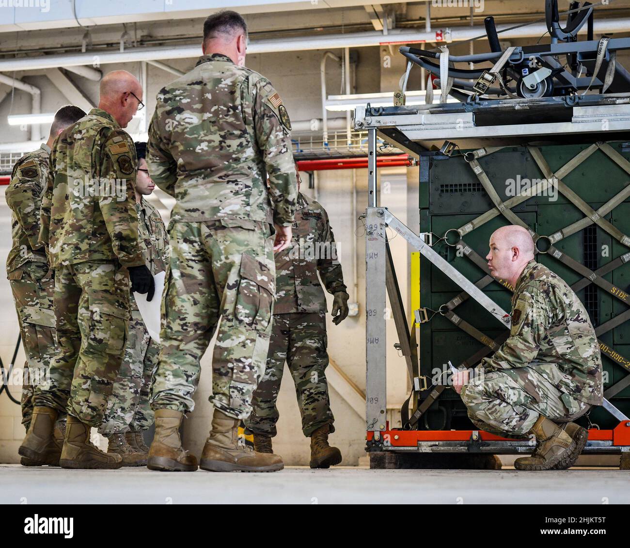 Members of the 147th Attack Wing test a vertical pallet stacking system ...