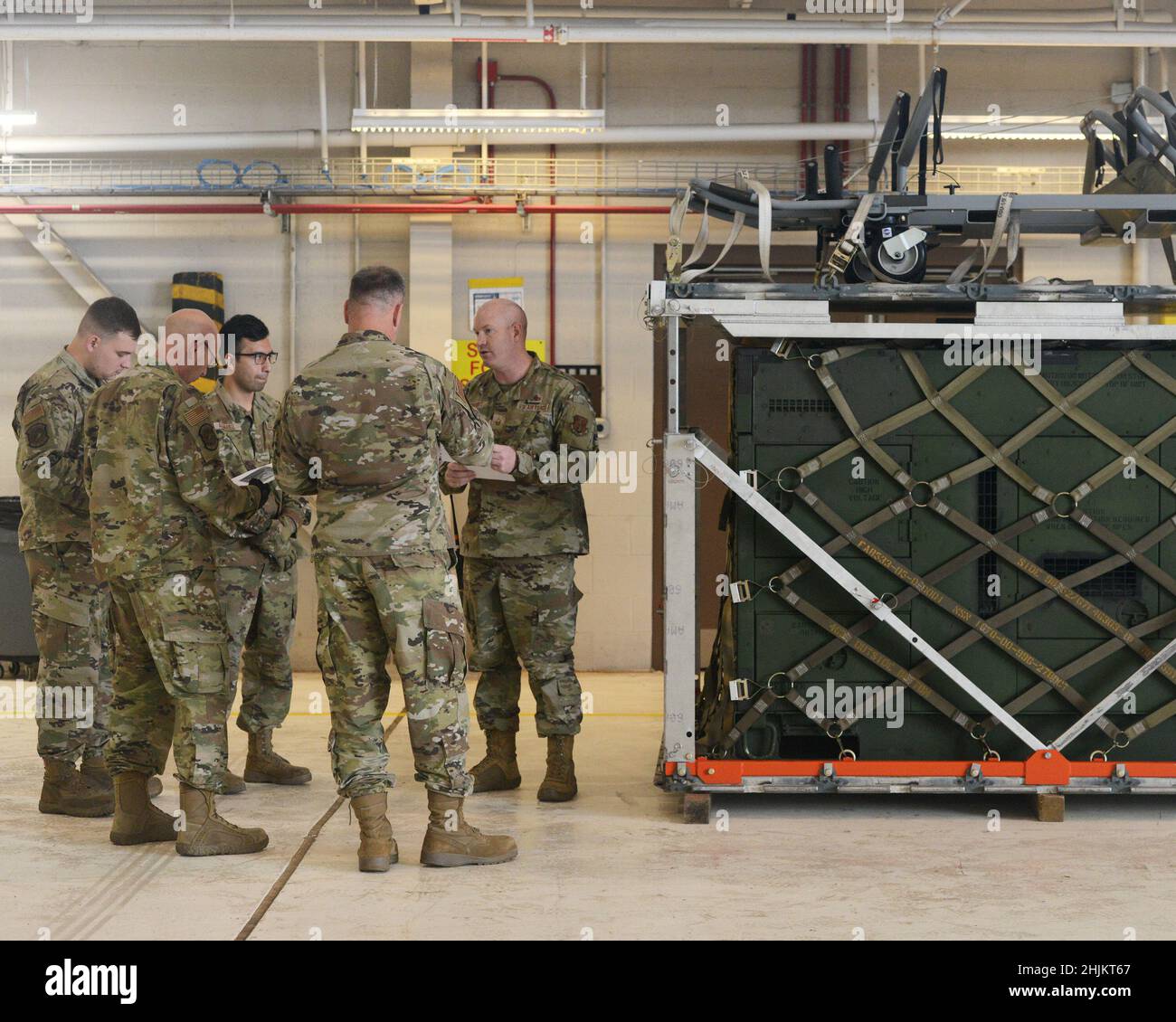 Members of the 147th Attack Wing test a vertical pallet stacking system ...