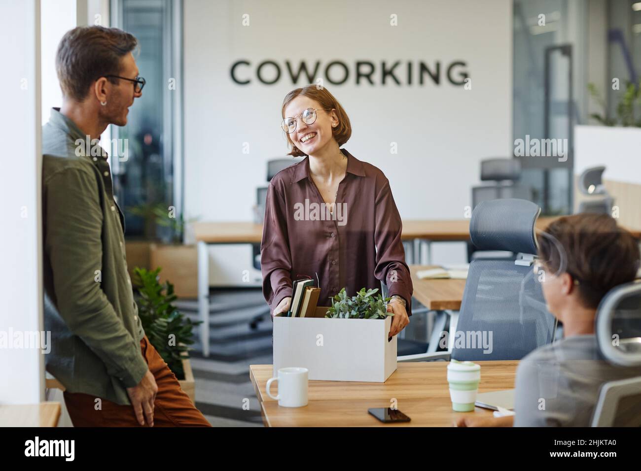 Group of young people welcoming new employee in office, career and ...