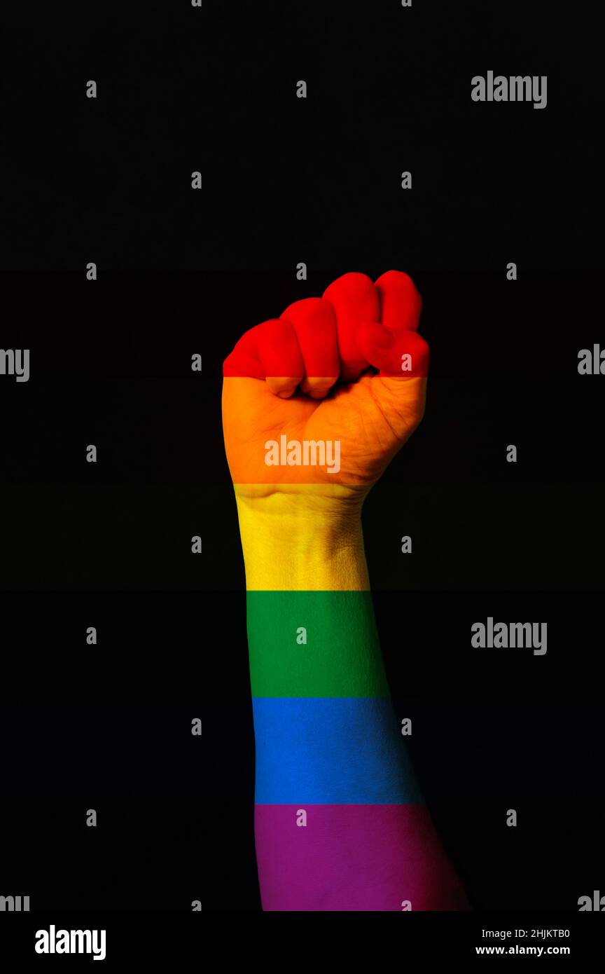 arm and raised fist symbol of woman empowerment Stock Photo - Alamy