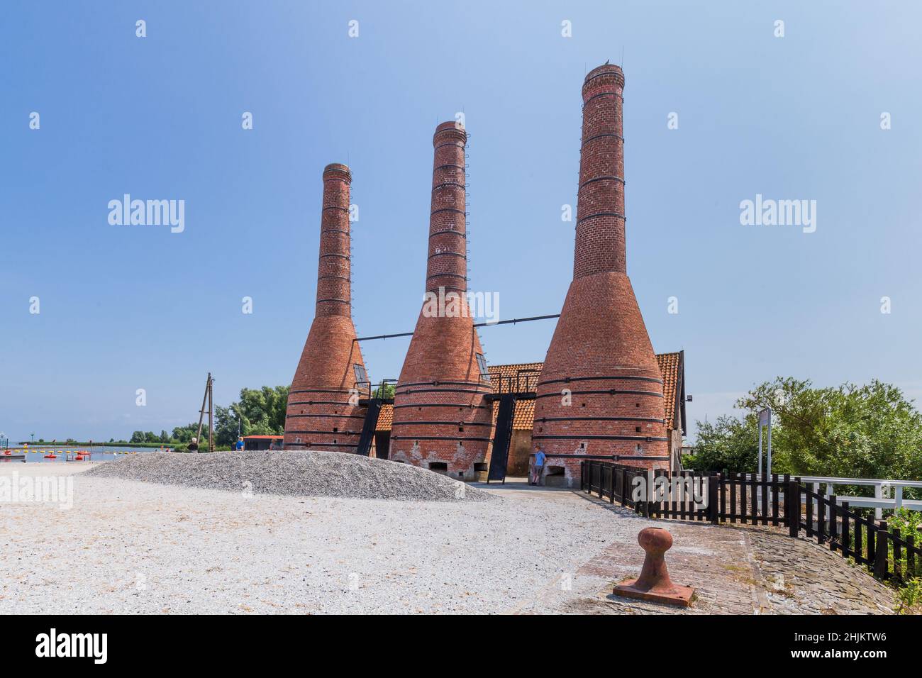 Brick smokestacks in traditional fishermans village with small houses a ...