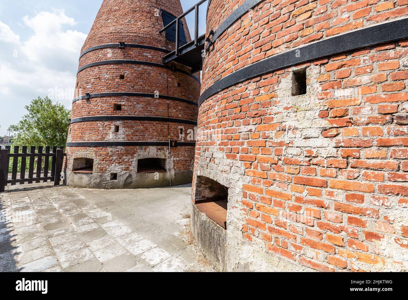 Brick smokestacks in traditional fishermans village with small houses a ...