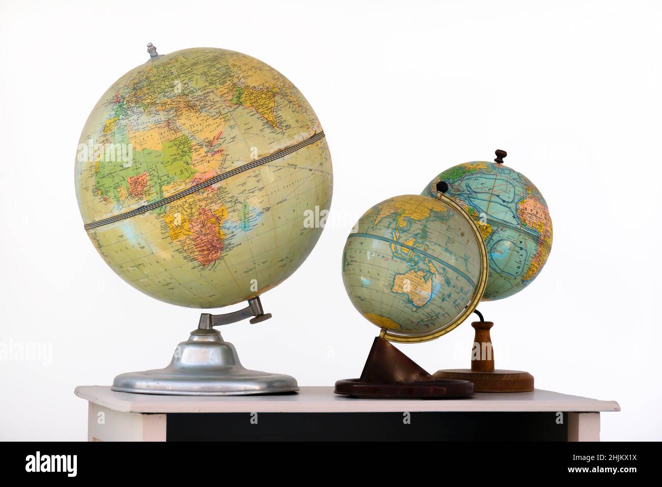 Three terrestrial globe on white bottom Stock Photo - Alamy
