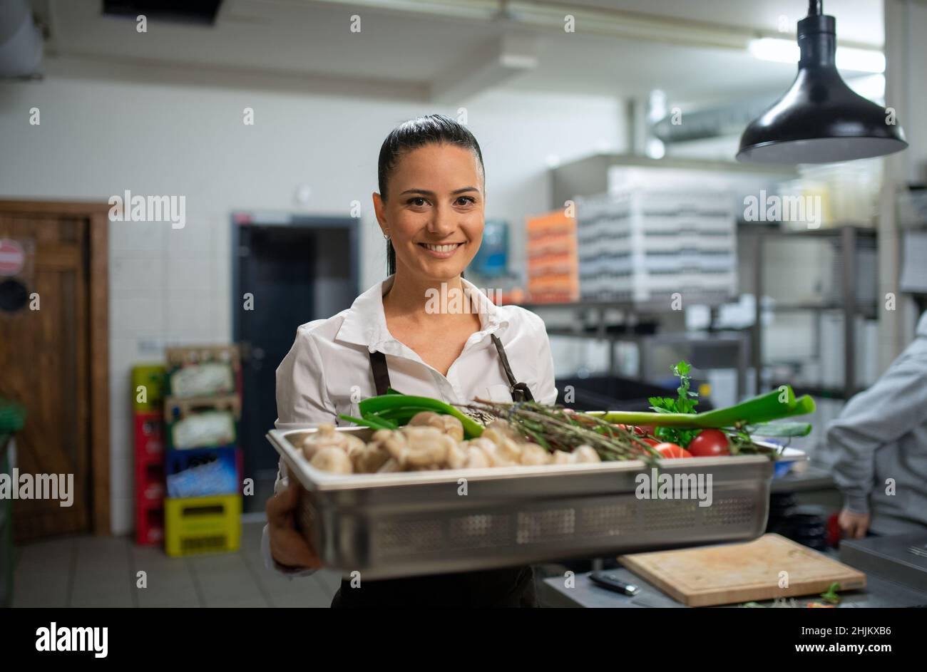 Female chef carrying tray hi-res stock photography and images - Alamy