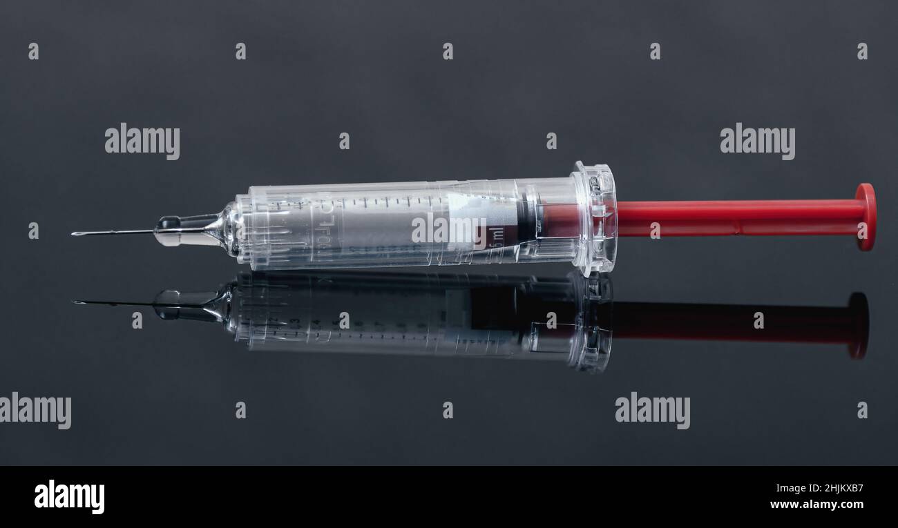 Closeup image of a medical syringe Stock Photo - Alamy