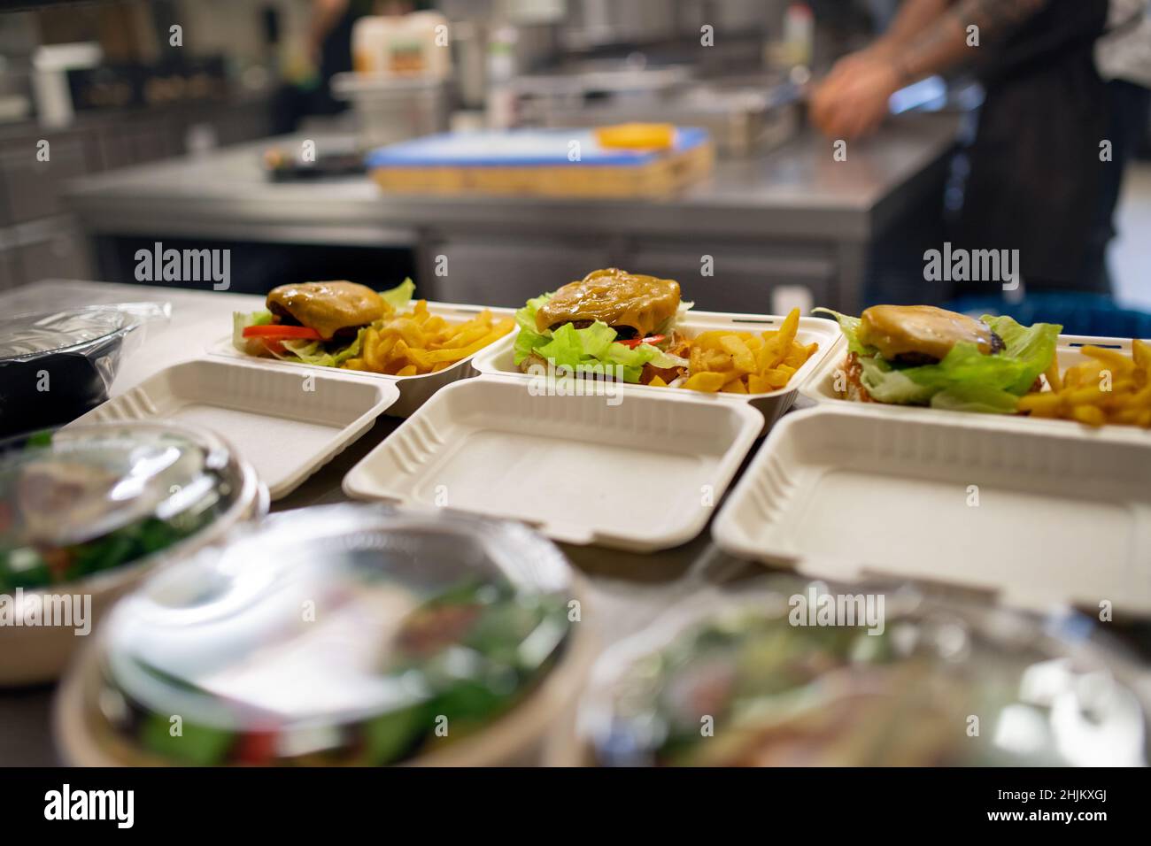 Meals in containers prepared for take away in kitchen restaurant Stock ...