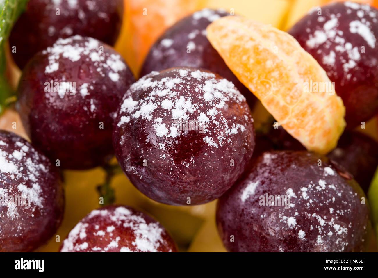 Grapes and orange on a fruit platter. Can be used as a whole background ...