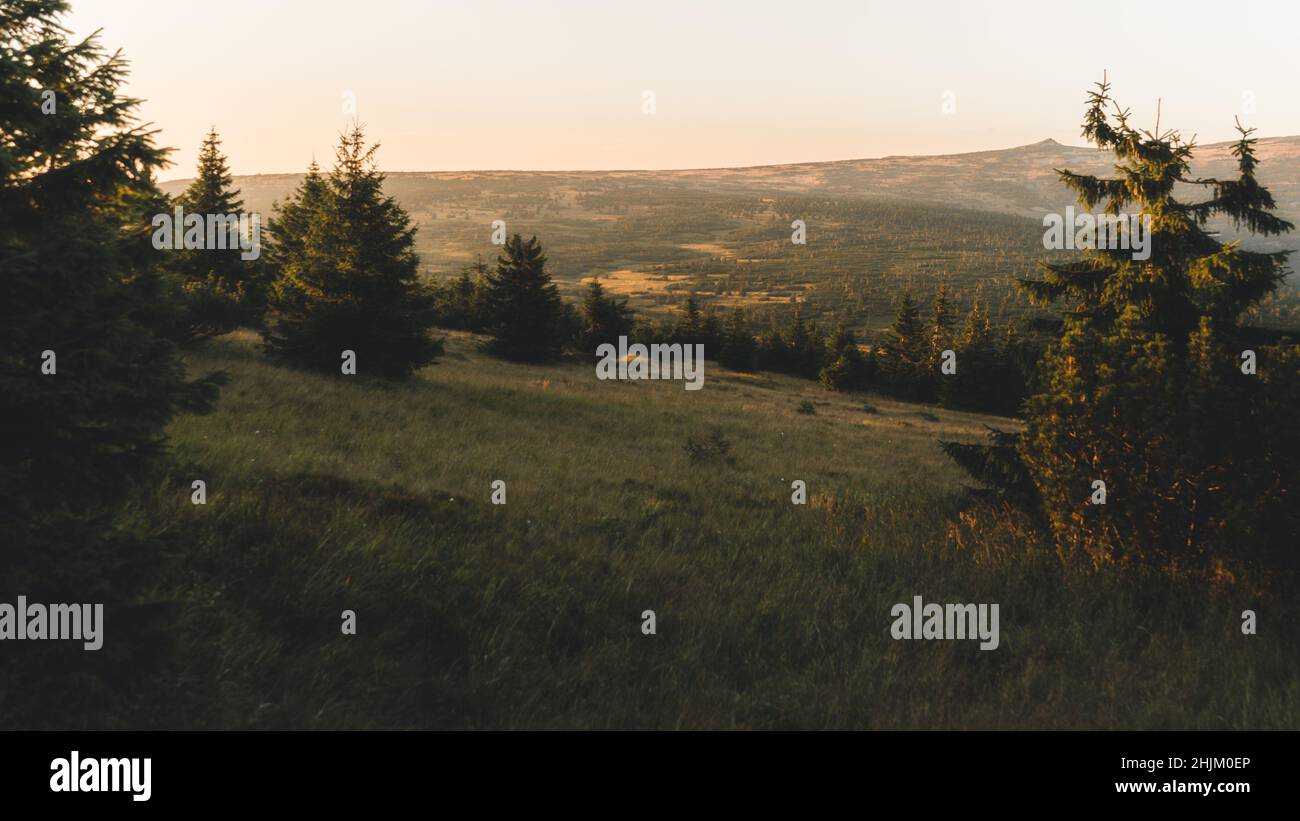 Hilly landscape at sunset hi-res stock photography and images - Alamy