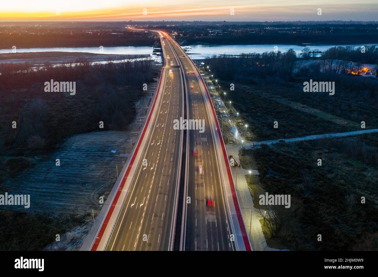 Bridge across the river, aerial view of express road at sunset Stock ...