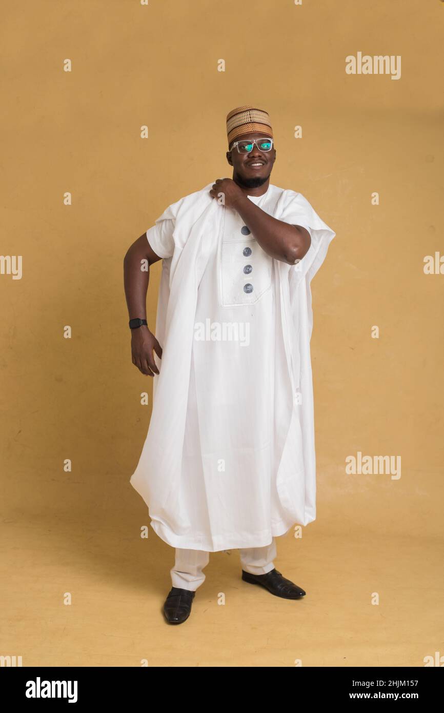 A Traditionally Dressed Northern Business Man Raising His Dress Over ...