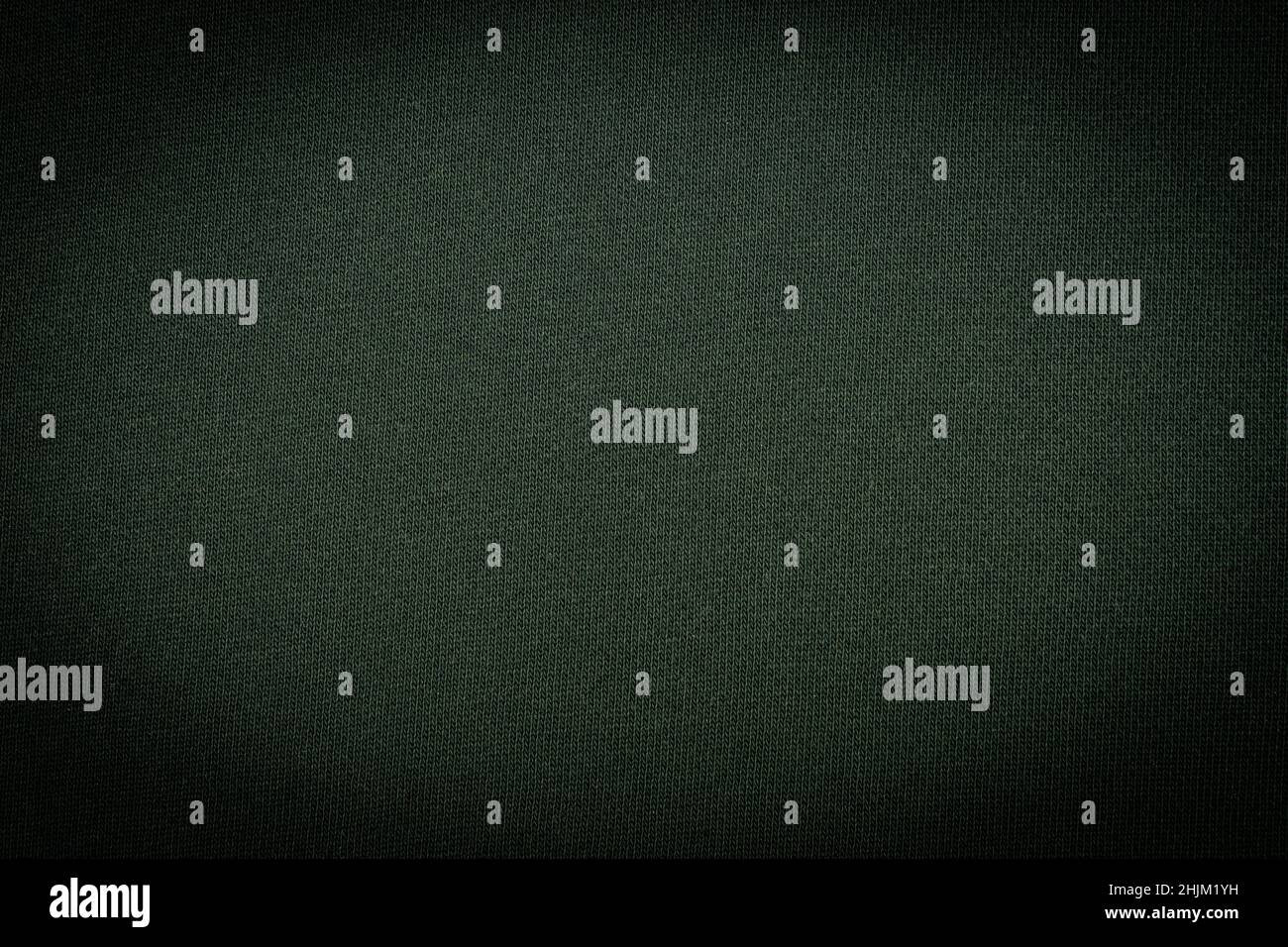 background or texture in the form of a green uniform dark green fabric ...