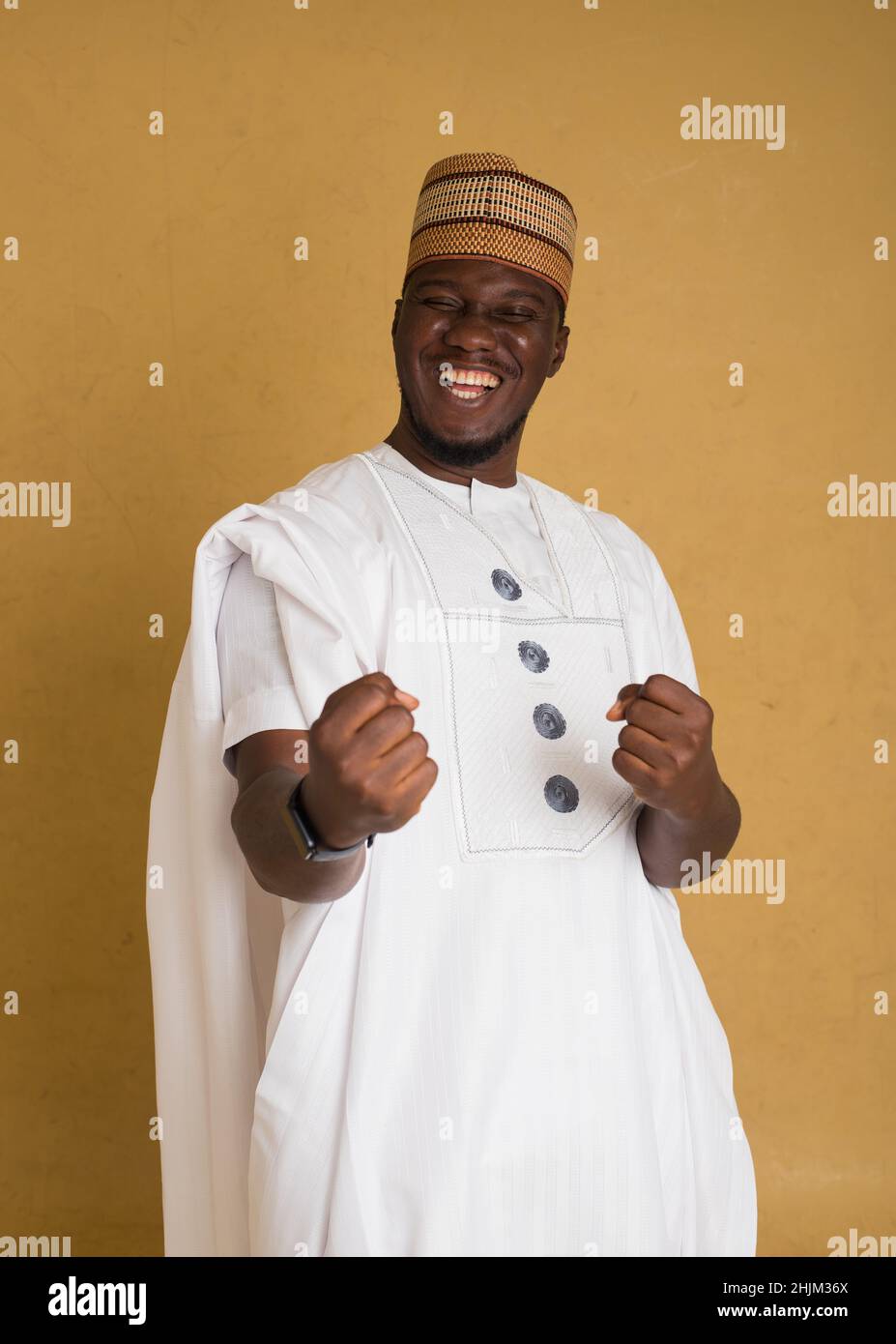 A Traditionally Dressed Northern Business Man Joyfully Winning Stock ...
