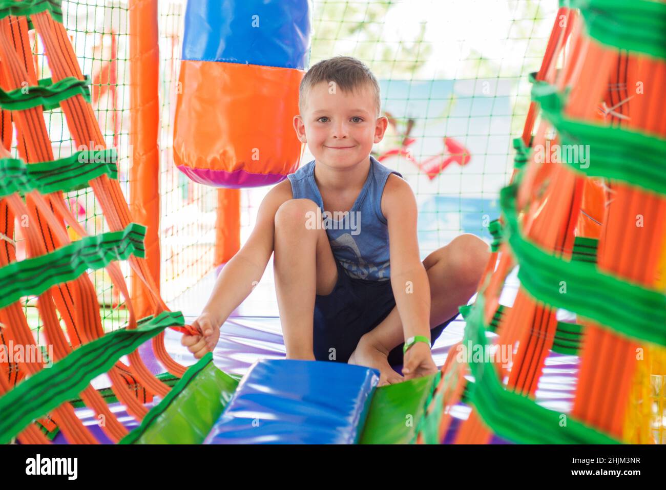 Boy playing on the playground, in the children's maze. Child playing on ...