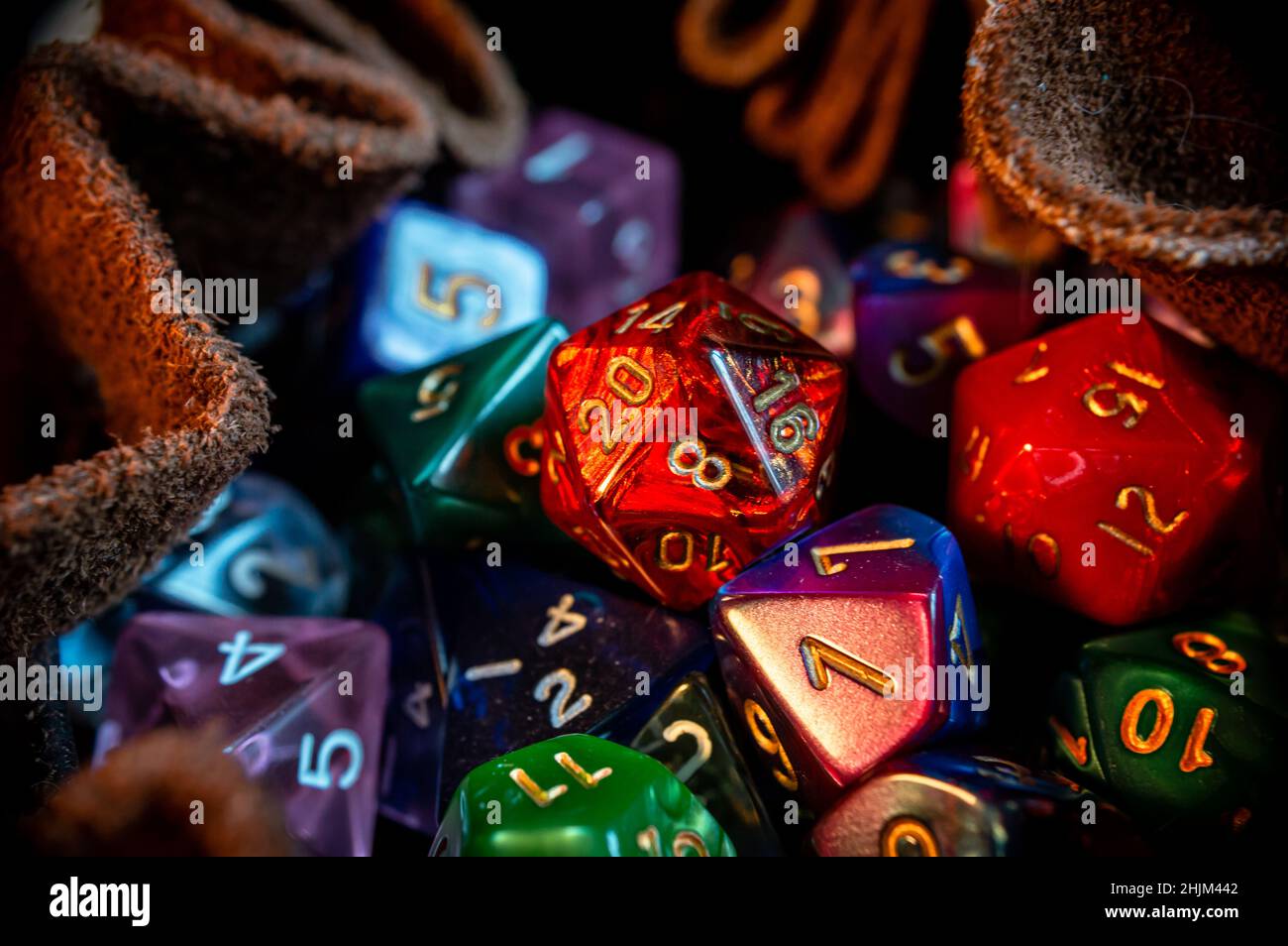 Close-up image of various colored role-playing gaming dice in a dice ...