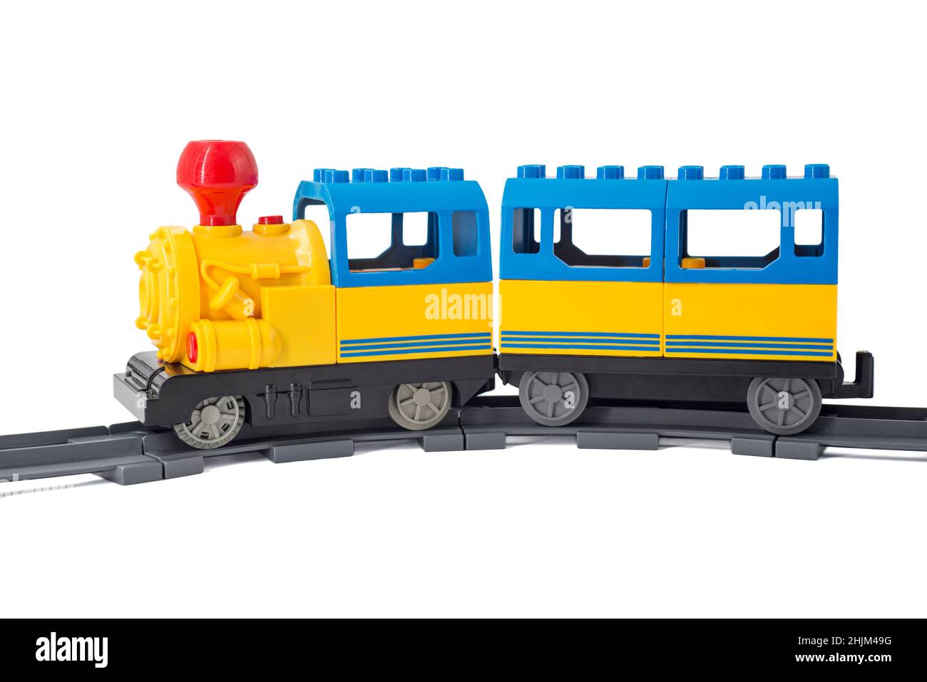 Colorful toy train on the rails, isolated on white background. Train ...