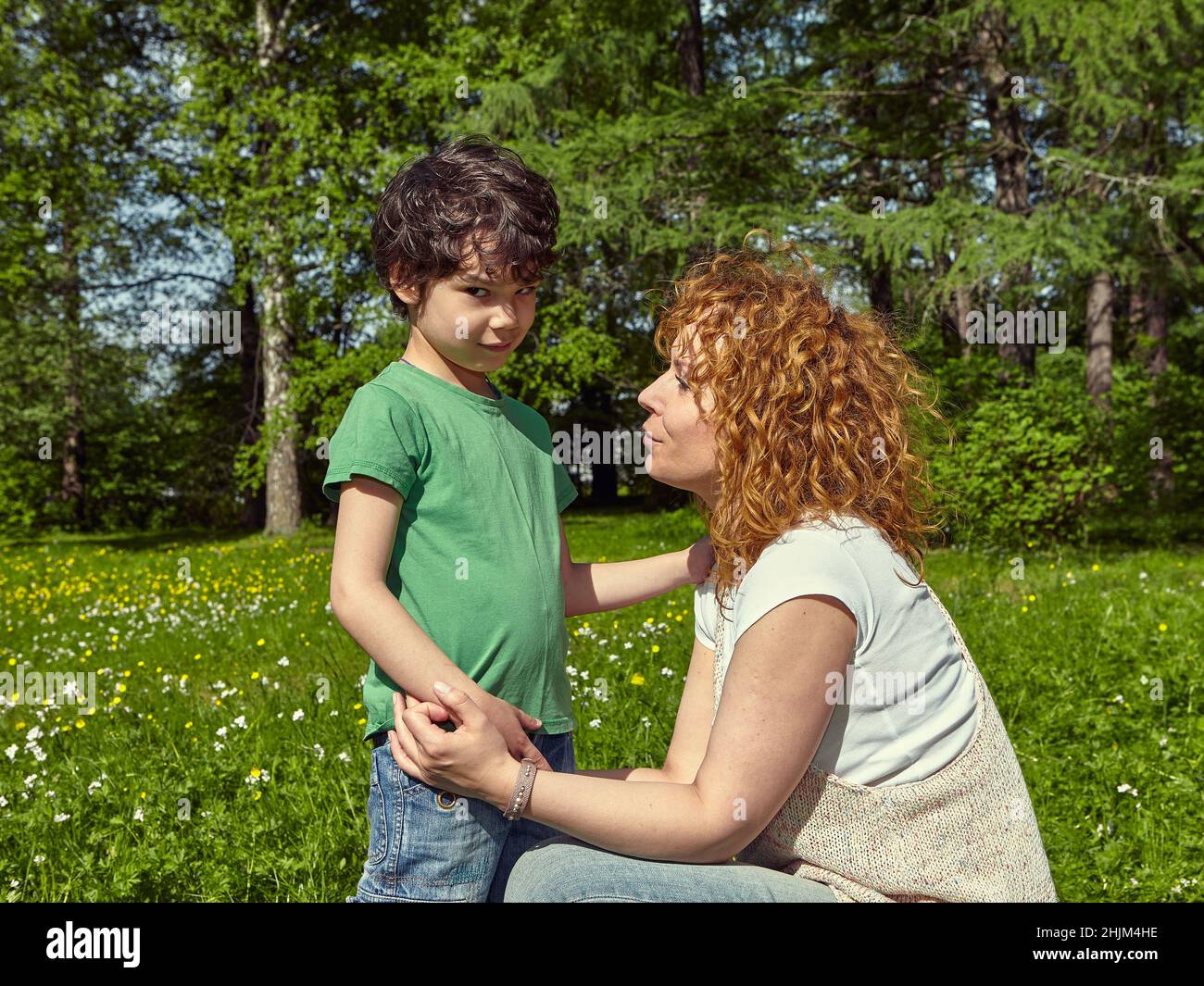 Red hair mother and her son have a playful conversation Stock Photo - Alamy