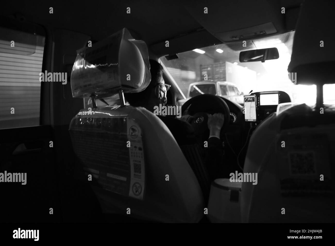 Driver driving in car Black and White Stock Photos & Images - Alamy